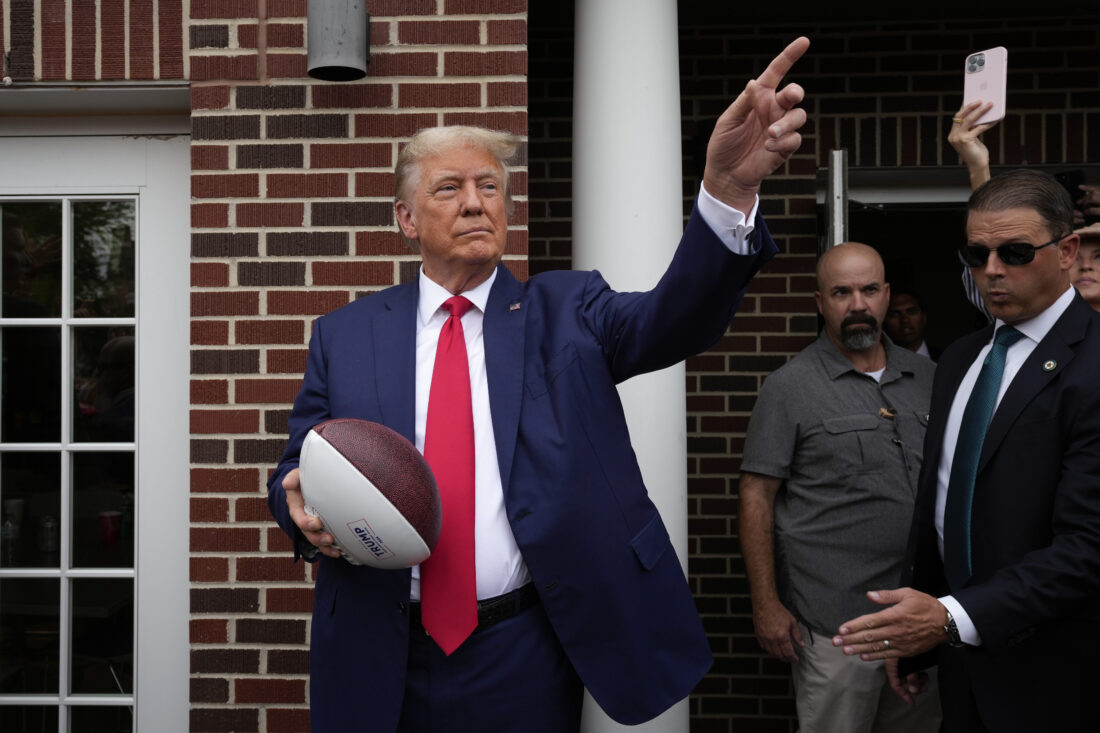 Trump stops at a frat house on his way to Cy-Hawk game, outdrawing ...